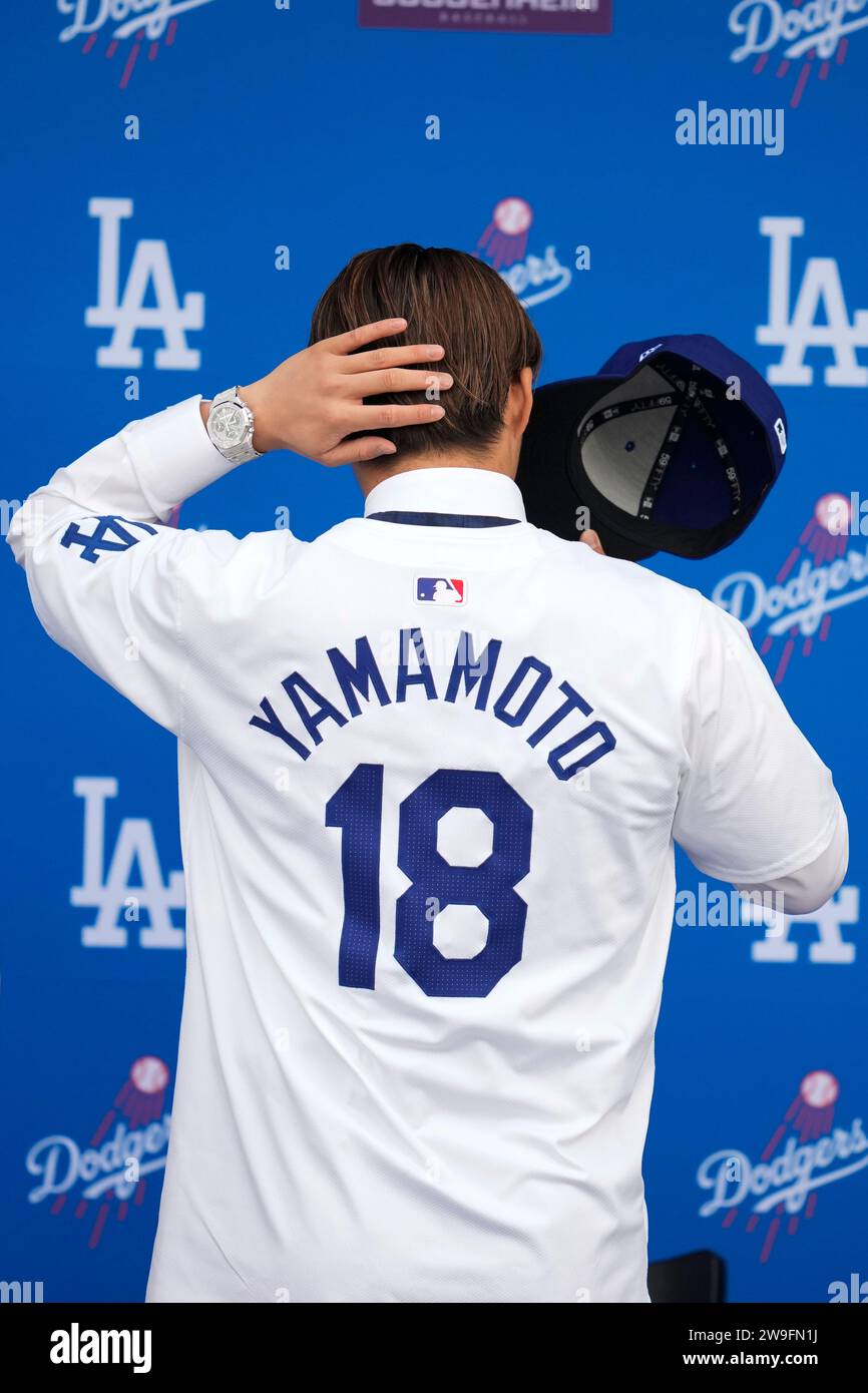 Yoshinobu Yamamoto wears his jersey during his introduction as a new member of the Los Angeles ...