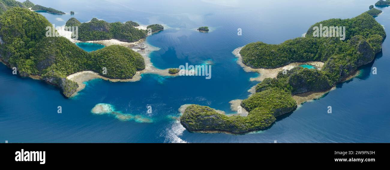 Limestone islands are fringed by beautiful reefs in Misool, Raja Ampat ...