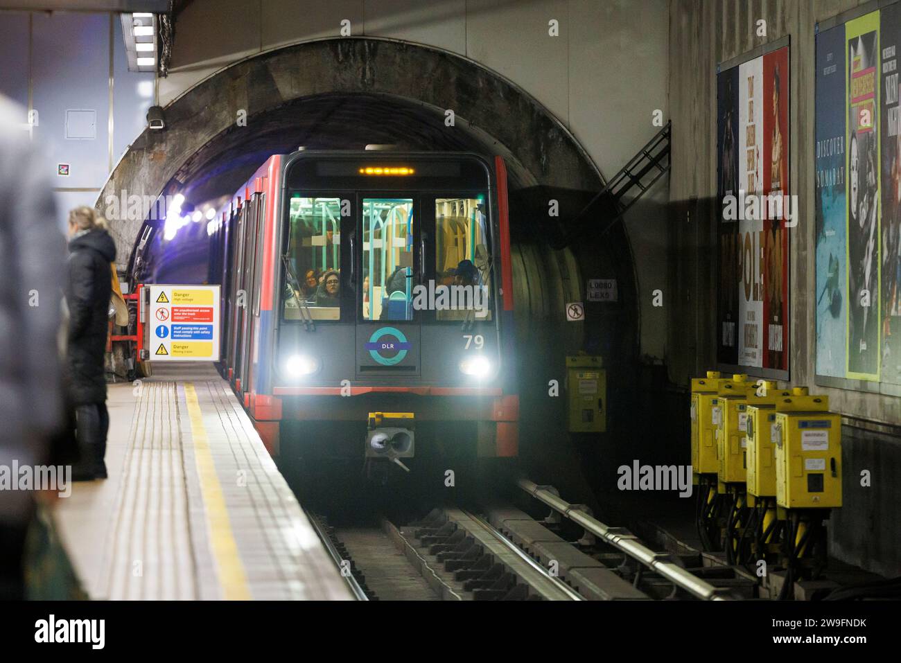 A Docklands Light Railway DLR train enters the northbound platform at ...