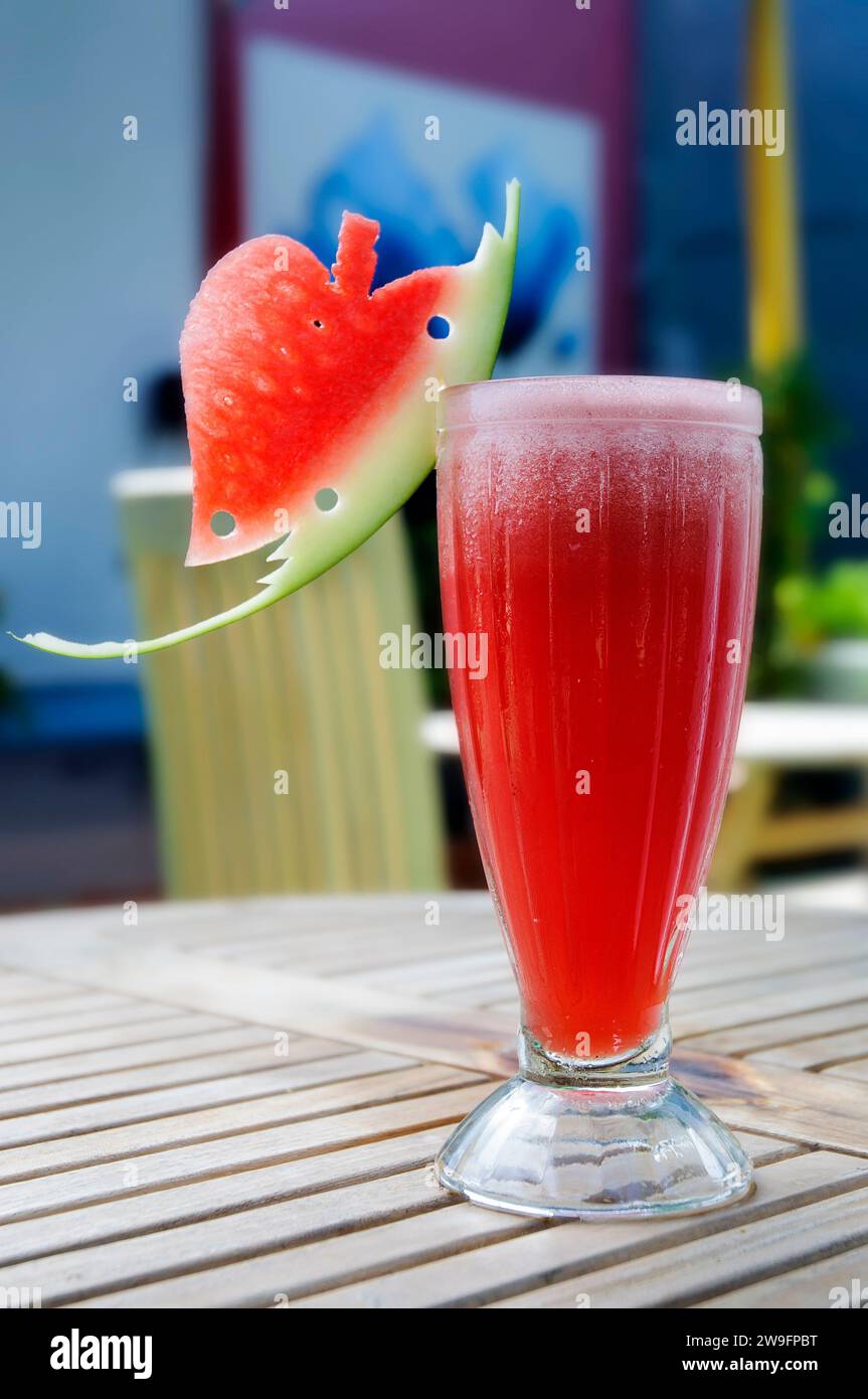Watermelon juice drinks with unique garnishes are placed on the table ...