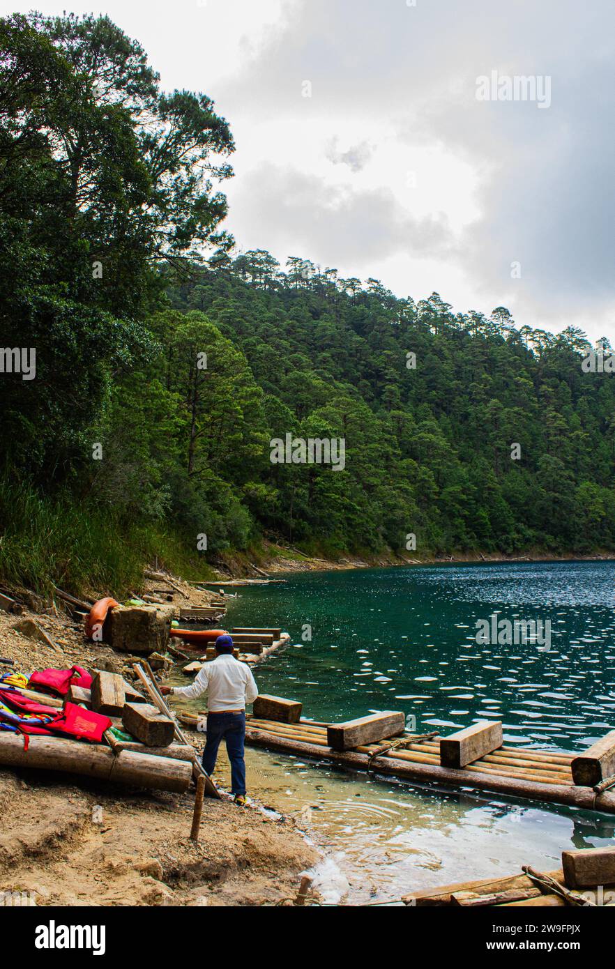 Lakeside Tranquility: Vertical Shot of Wooden Pier on Chiapas Lake ...