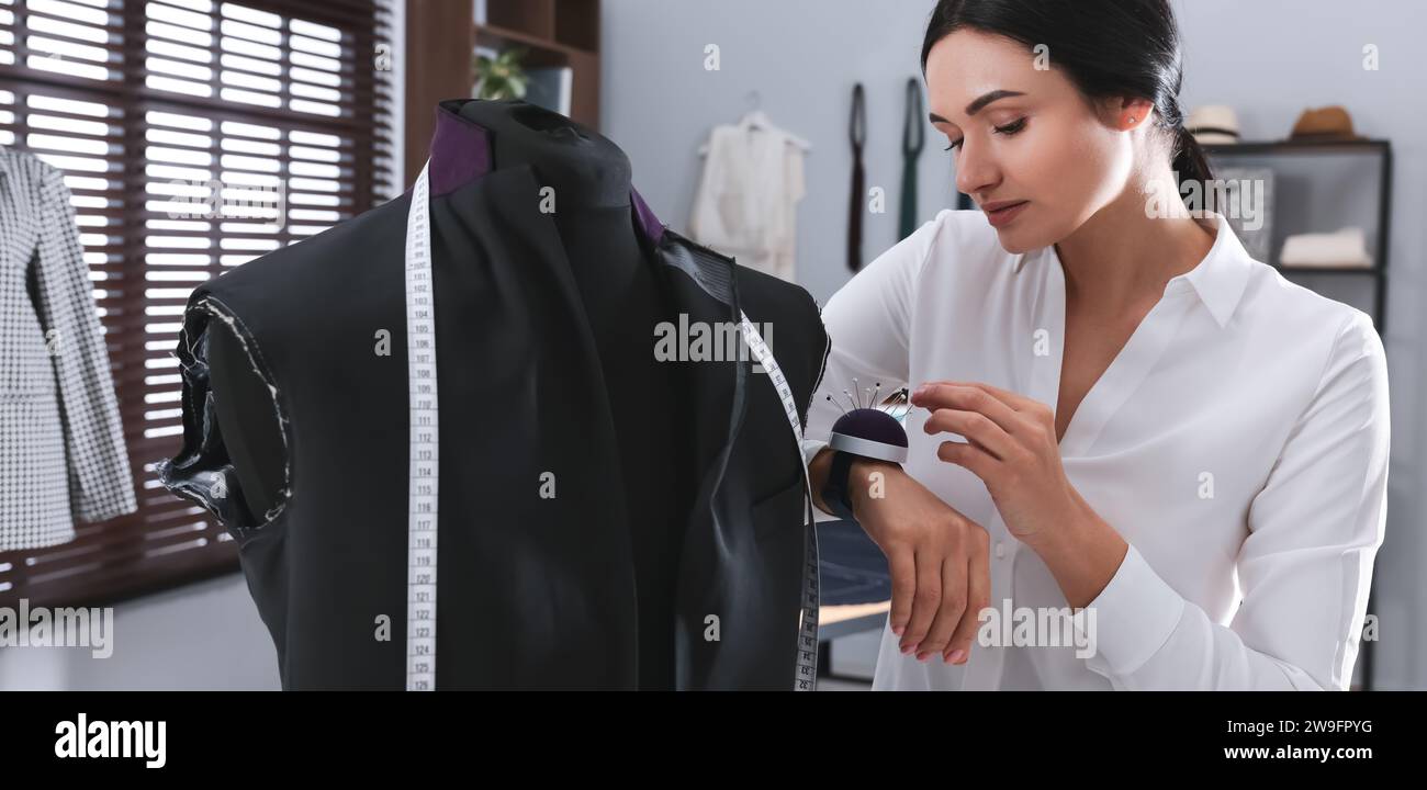 Professional dressmaker making suit jacket in atelier. Banner design ...