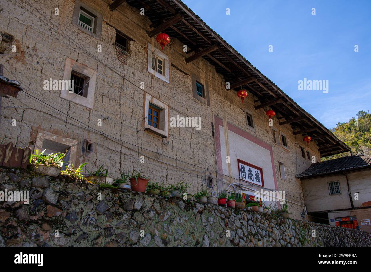 The old traditional buildings in the Tuxi village around Tulou clusters ...