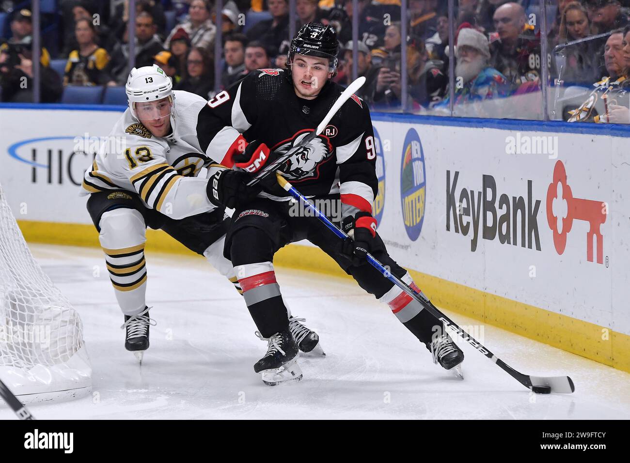Buffalo Sabres left wing Zach Benson, right, shields the puck from ...