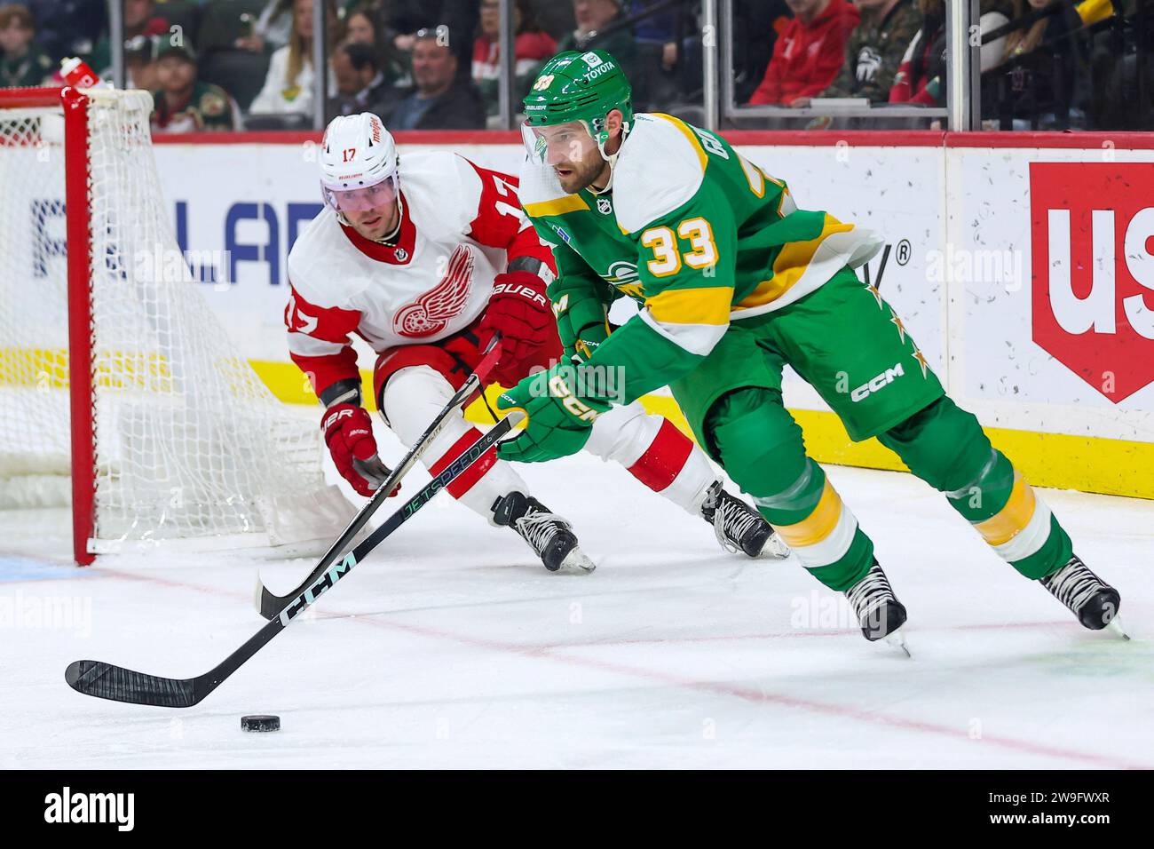 Minnesota Wild defenseman Alex Goligoski, right, skates with the puck ...