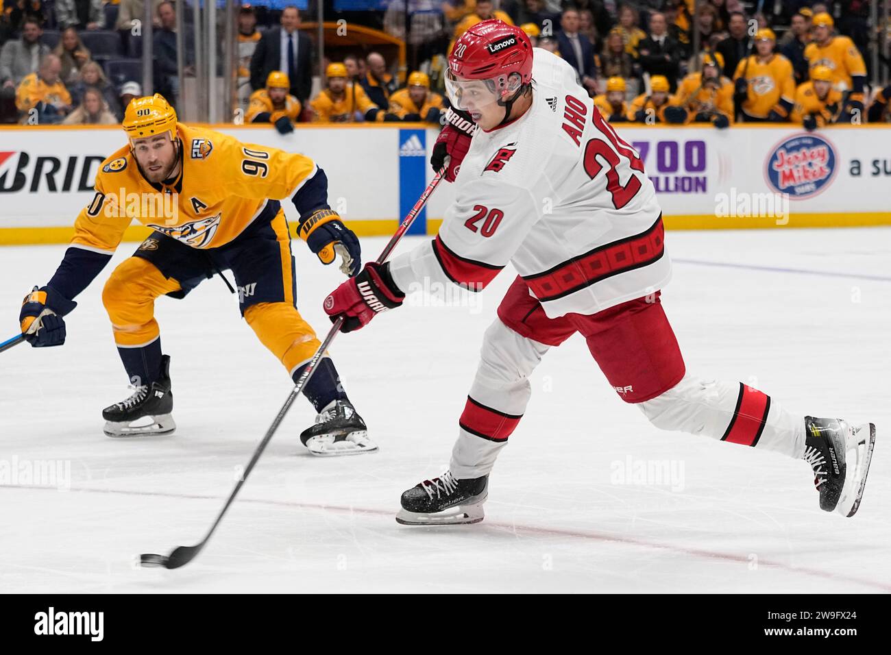 Carolina Hurricanes center Sebastian Aho (20) shoots the puck for a ...