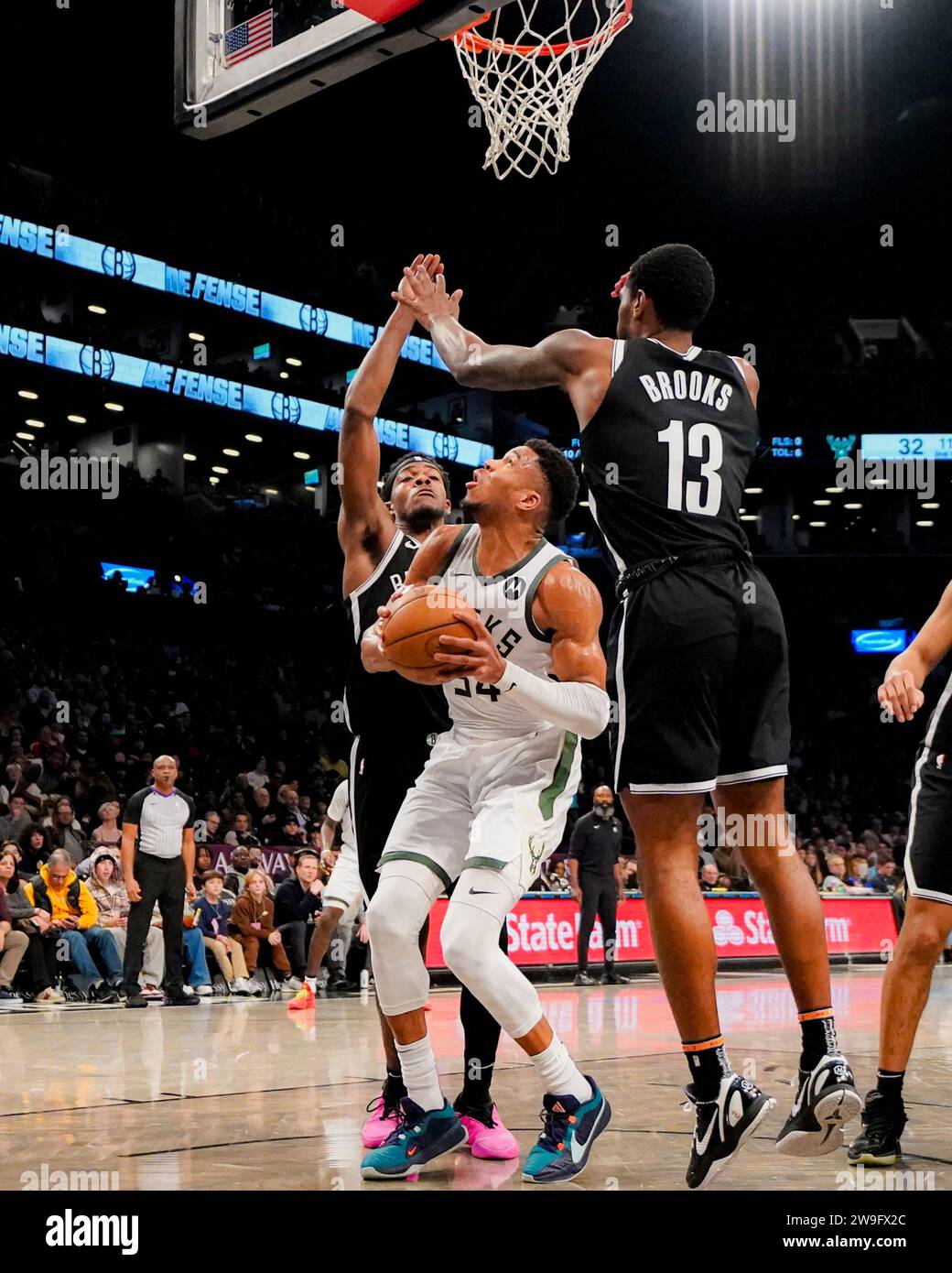 Milwaukee Bucks forward Giannis Antetokounmpo (34) is defended by Brooklyn Nets center Day'Ron ...
