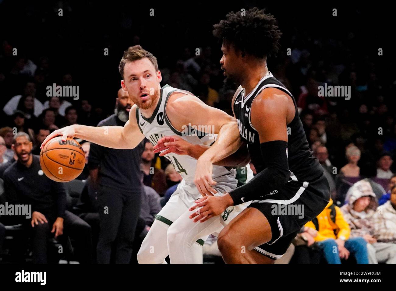 Milwaukee Bucks guard Pat Connaughton is defended by Brooklyn Nets ...