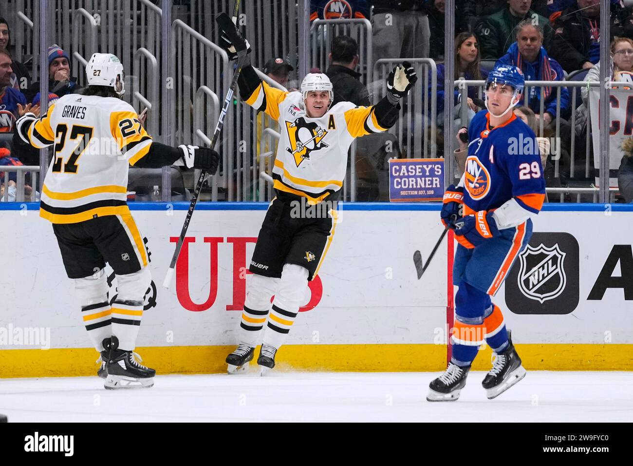 Pittsburgh Penguins' Evgeni Malkin, center, celebrates with Ryan Graves ...