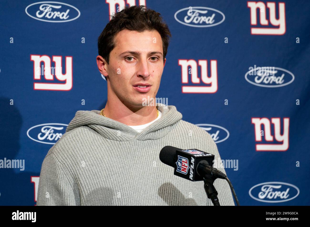 New York Giants quarterback Tommy DeVito (15) talks to be media ...