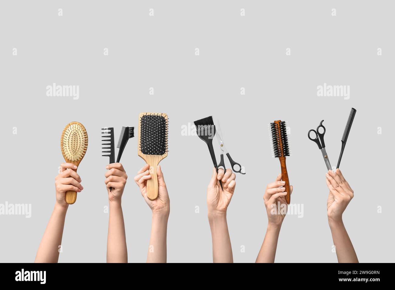 Many hands hairdresser hi-res stock photography and images - Alamy
