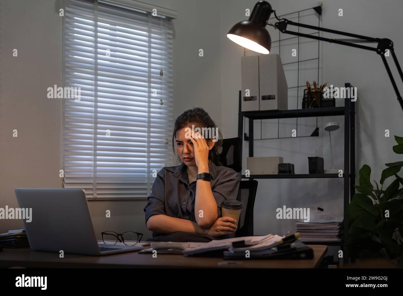 Business woman asian in office, tired or fatigue while working late at ...