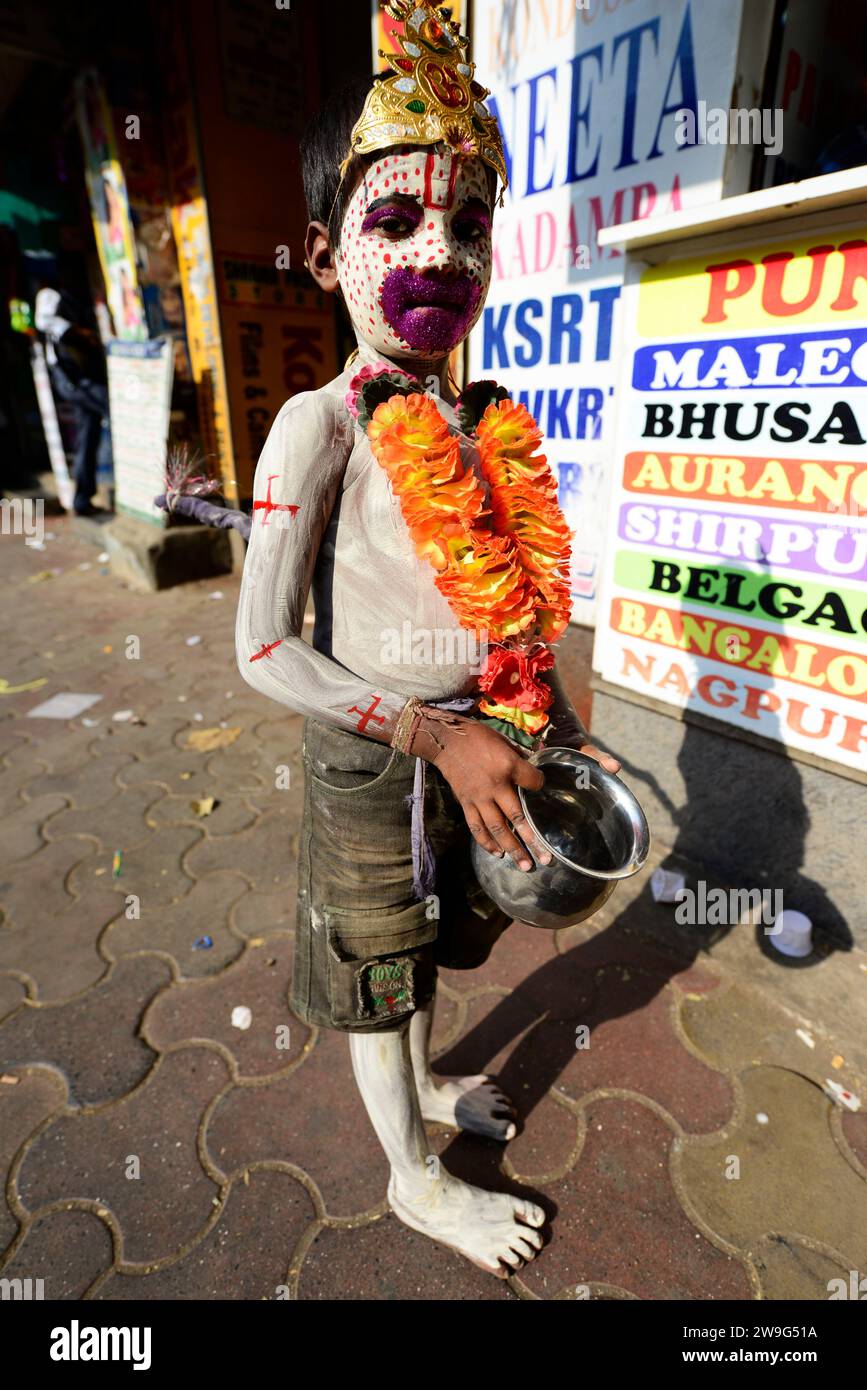 Portrait of a boy dressed as the monkey god Hanuman in the streets of ...