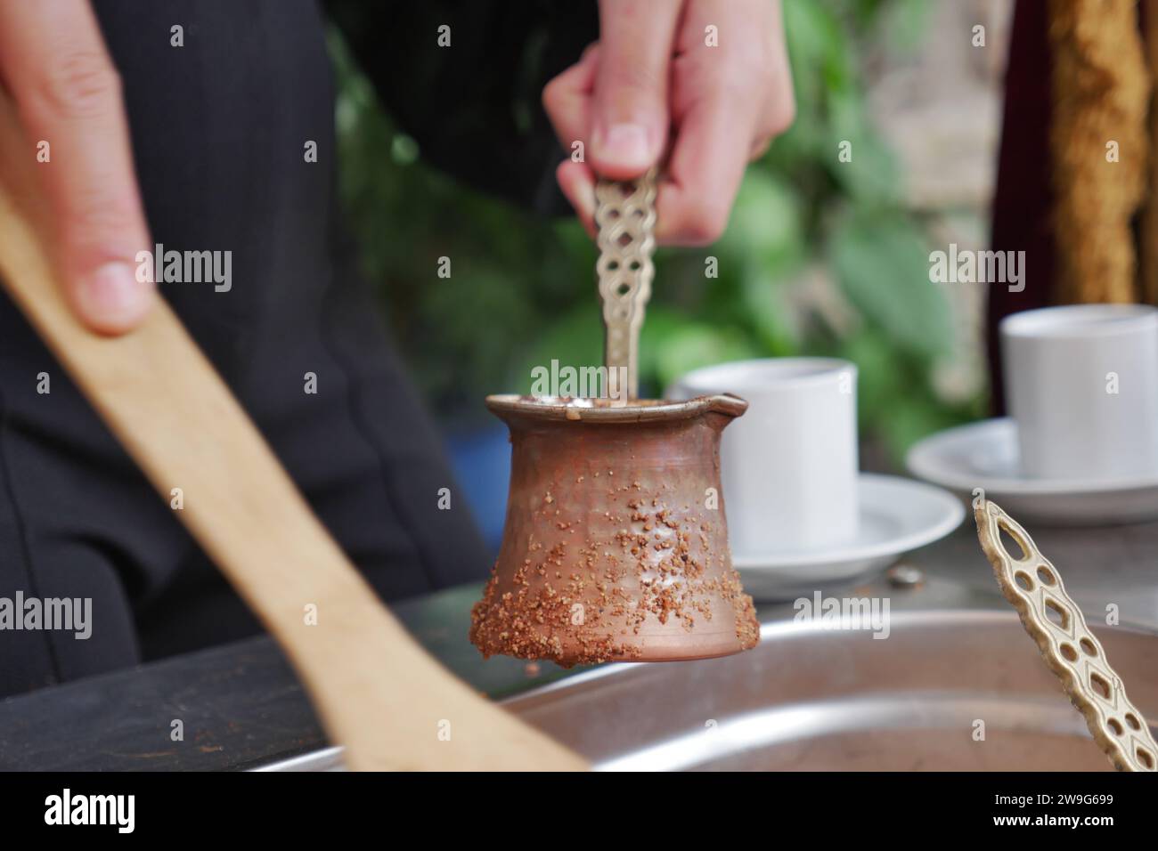 top view of making traditional turkish coffee on sand Stock Photo - Alamy