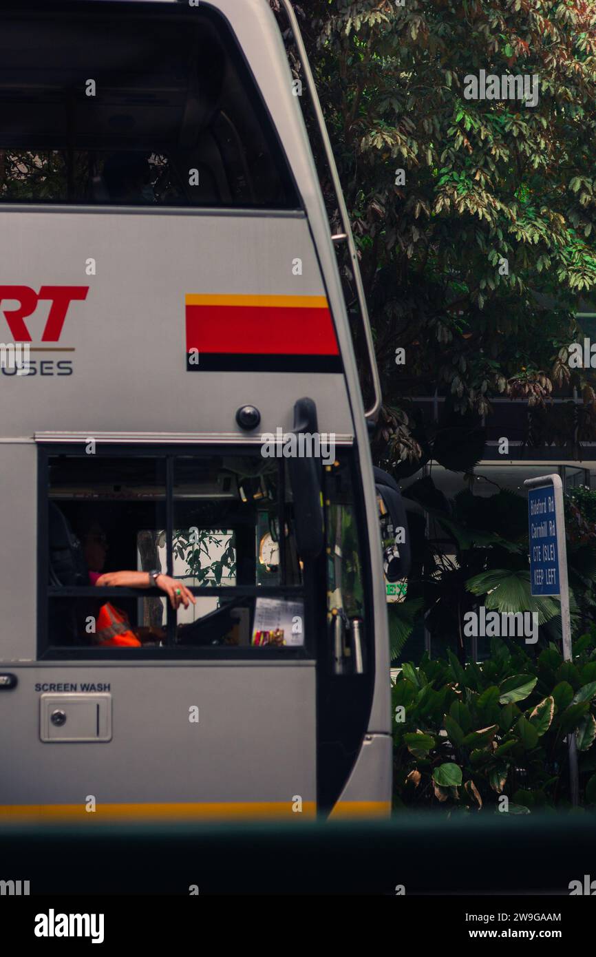 A double decker bus stopping at a red light on Orchard Road Singapore ...
