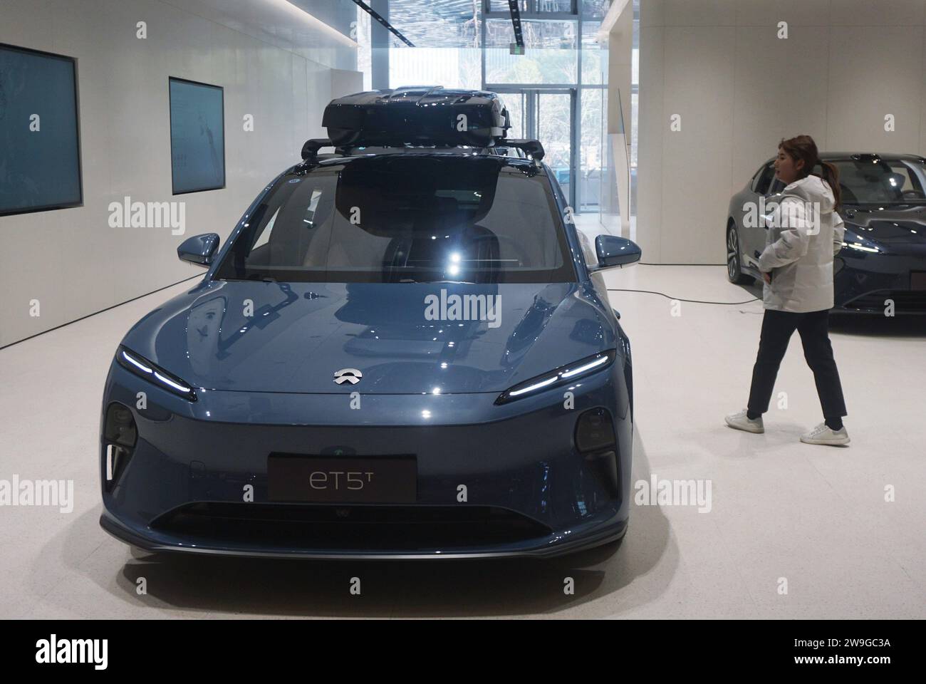 HANGZHOU, CHINA - DECEMBER 28, 2023 - A customer shops at a Nio auto ...