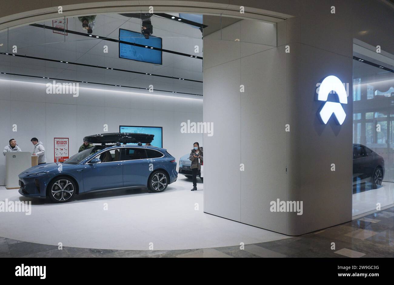 HANGZHOU, CHINA - DECEMBER 28, 2023 - A customer shops at a Nio auto store in Hangzhou, Zhejiang ...