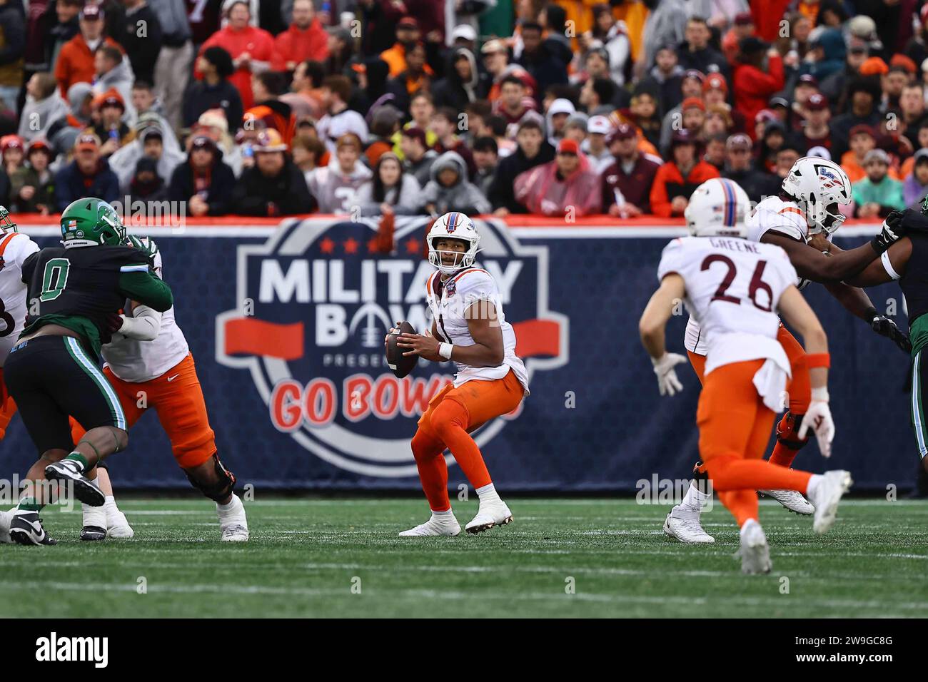 Annapolis, MD, USA. 27th Dec, 2023. Virginia Tech Hokies quarterback KYRON DRONES (1) attempt a ...
