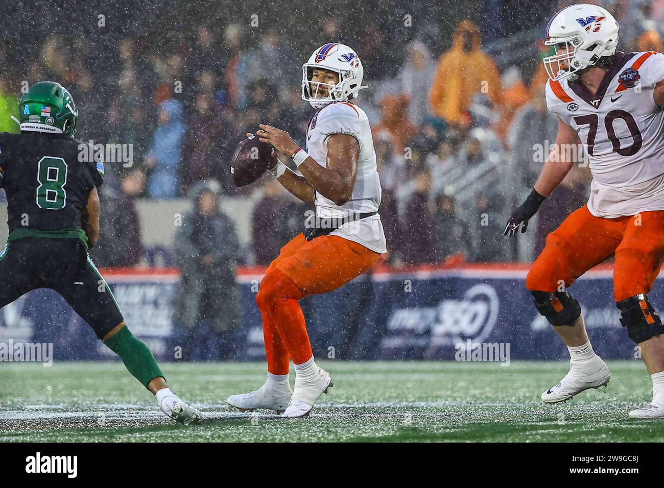 Annapolis, MD, USA. 27th Dec, 2023. Virginia Tech Hokies quarterback KYRON DRONES (1) attempt a ...