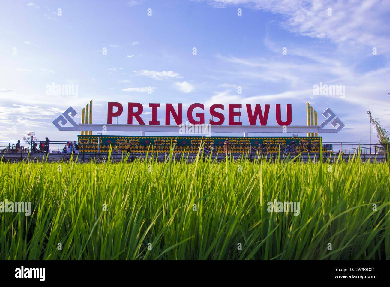 Landmark Pringsewu in the middle of rice fields. Welcome monument to ...