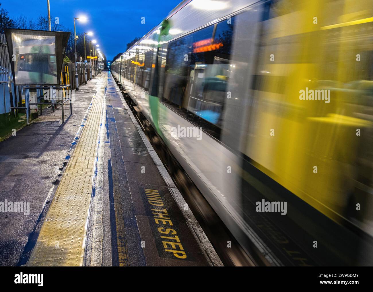 A passenger commuter train passing through Burgess Hill,railway station ...