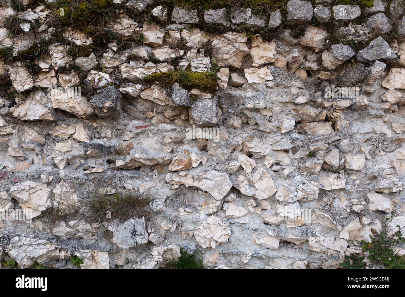 An ancient masonry wall in Germany, constructed with limestone bricks ...