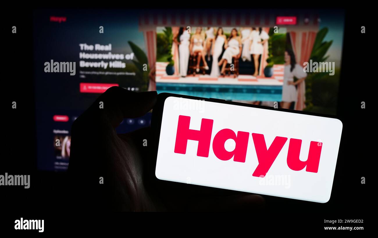 Person holding mobile phone with logo of American video streaming ...