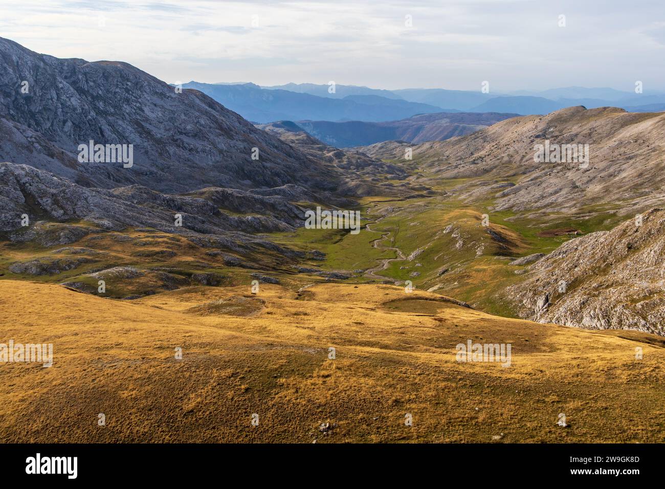 The beauty of untouched wilderness showcased in a panoramic mountain spectacle Stock Photo - Alamy