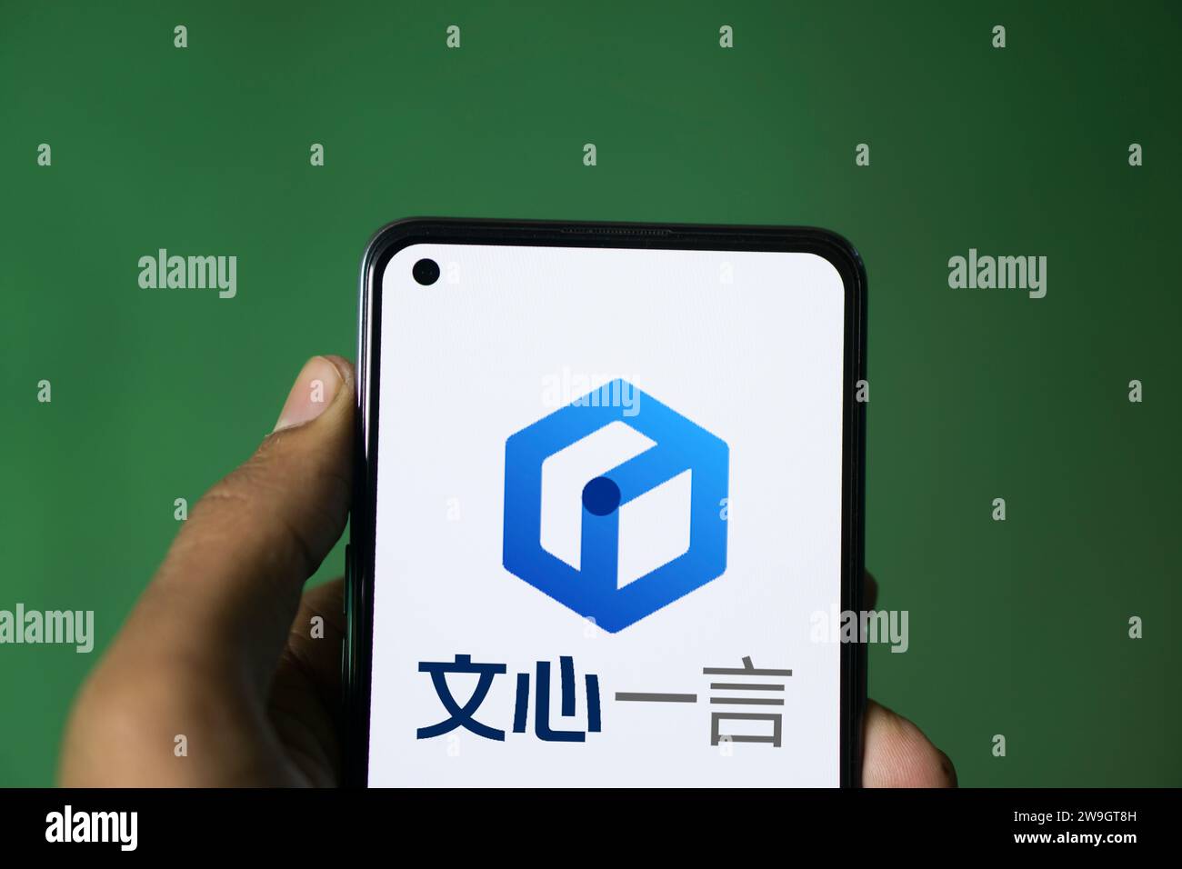 Dhaka, Bangladesh - 27 December 2023: Hand holding a phone with Ernie ...