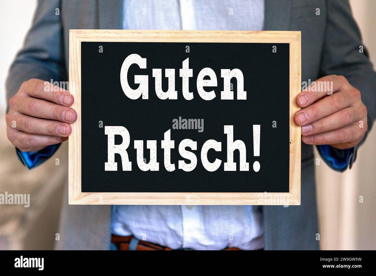 December 28, 2023: Man in suit holding a plaque with the inscription ...