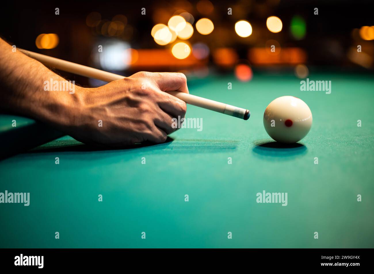 Young man playing snooker, aiming. for a good shot Stock Photo - Alamy