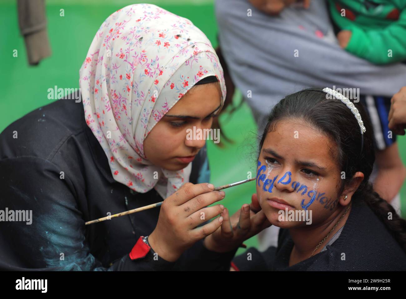 Palestinian artist Menna Allah Hamouda, 20, is drawing 2024 and ...
