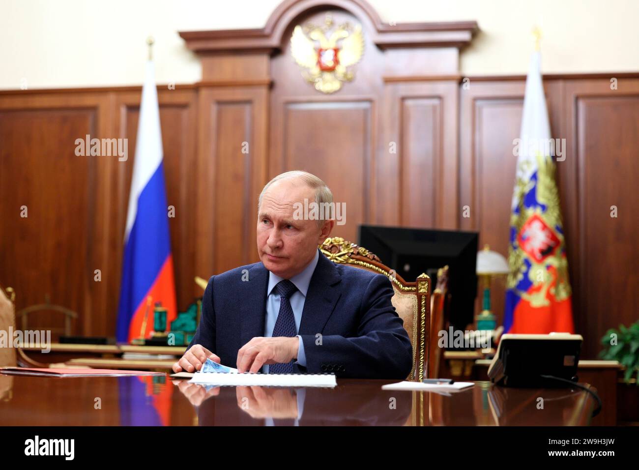 Russian President Vladimir Putin listens to Rostec State Corporation ...