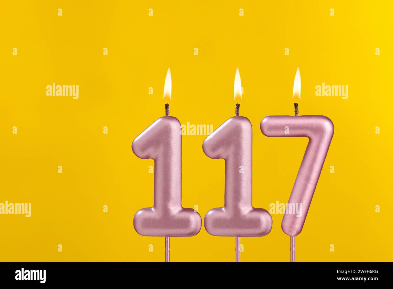 Birthday candle number 117 - Birthday celebration on yellow background ...