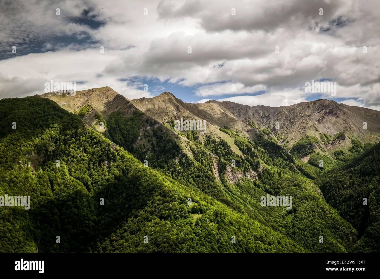 The beauty of untouched wilderness showcased in a panoramic mountain spectacle Stock Photo - Alamy