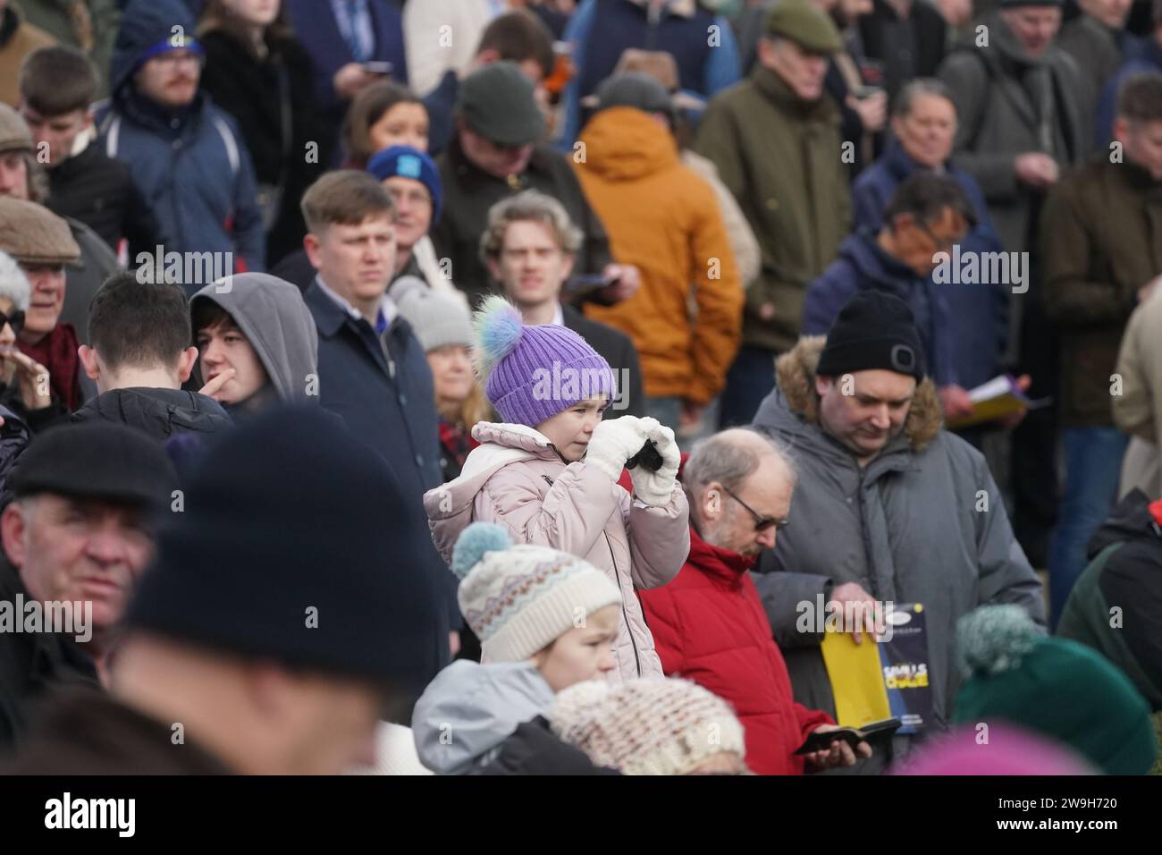 Jamie Brady aged 7 from Dublin watches the races during day three of ...