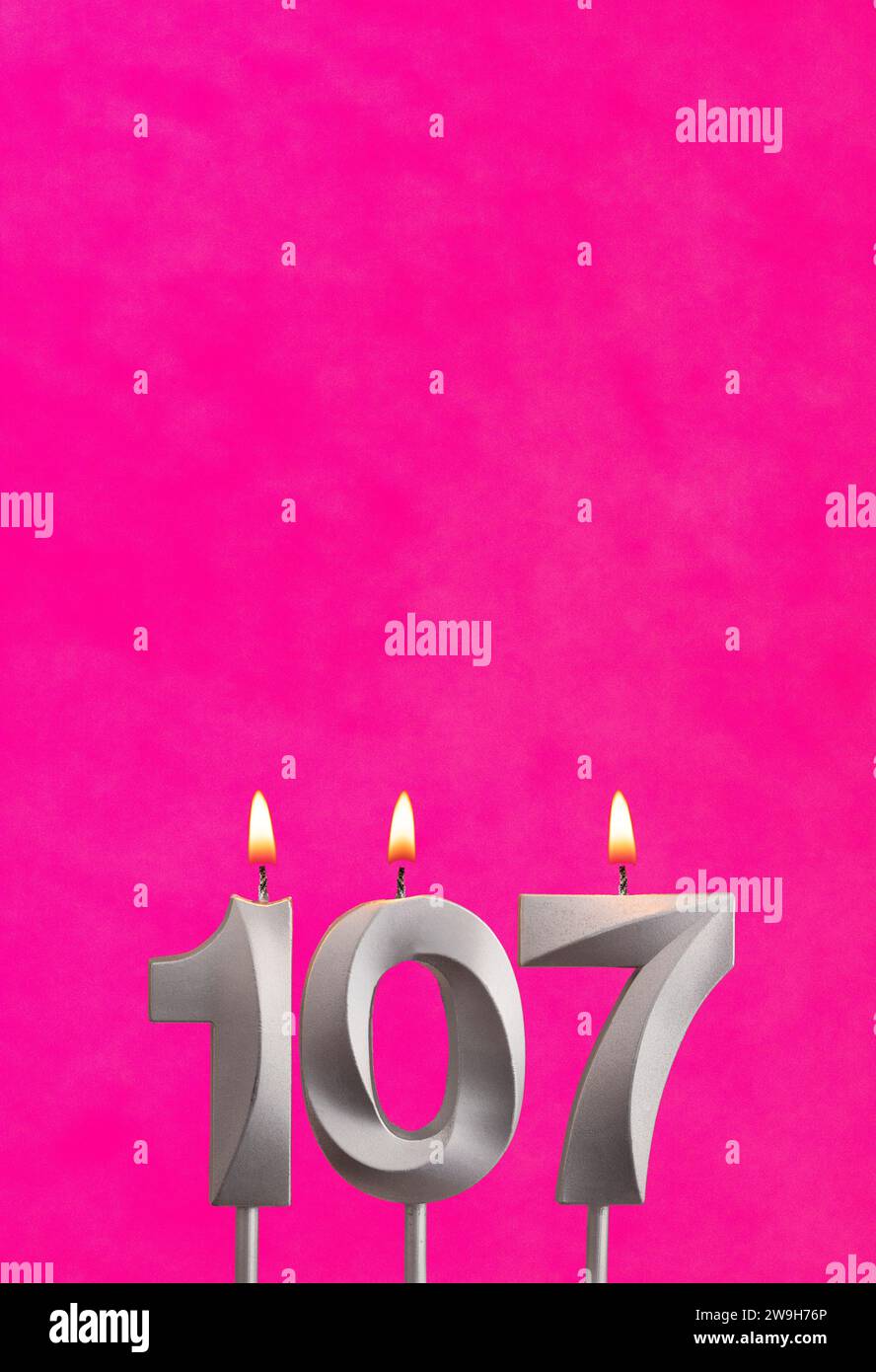 Candle number 107 - Birthday celebration on fuchsia background Stock ...