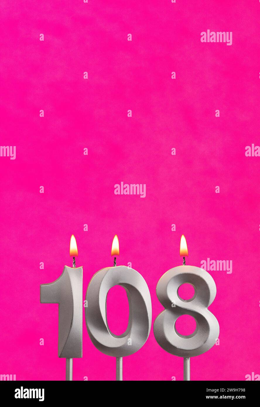 Candle 108 with flame - Birthday card in fuchsia background Stock Photo ...