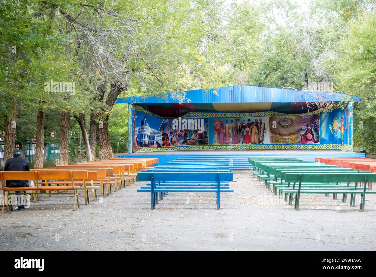 An open-air scene stage theater with benches set up in a public park in ...