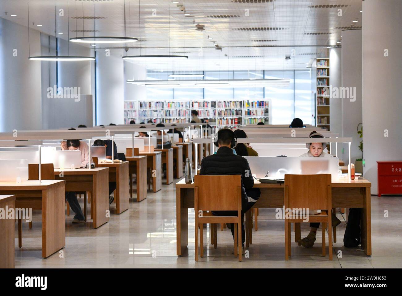 Shenzhen, China's Guangdong Province. 28th Dec, 2023. People read at ...