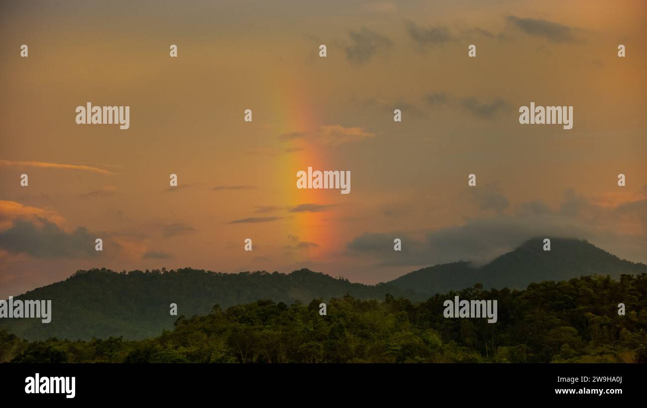 Super sunset sky with mountain silhouettes and decorated with naturally ...