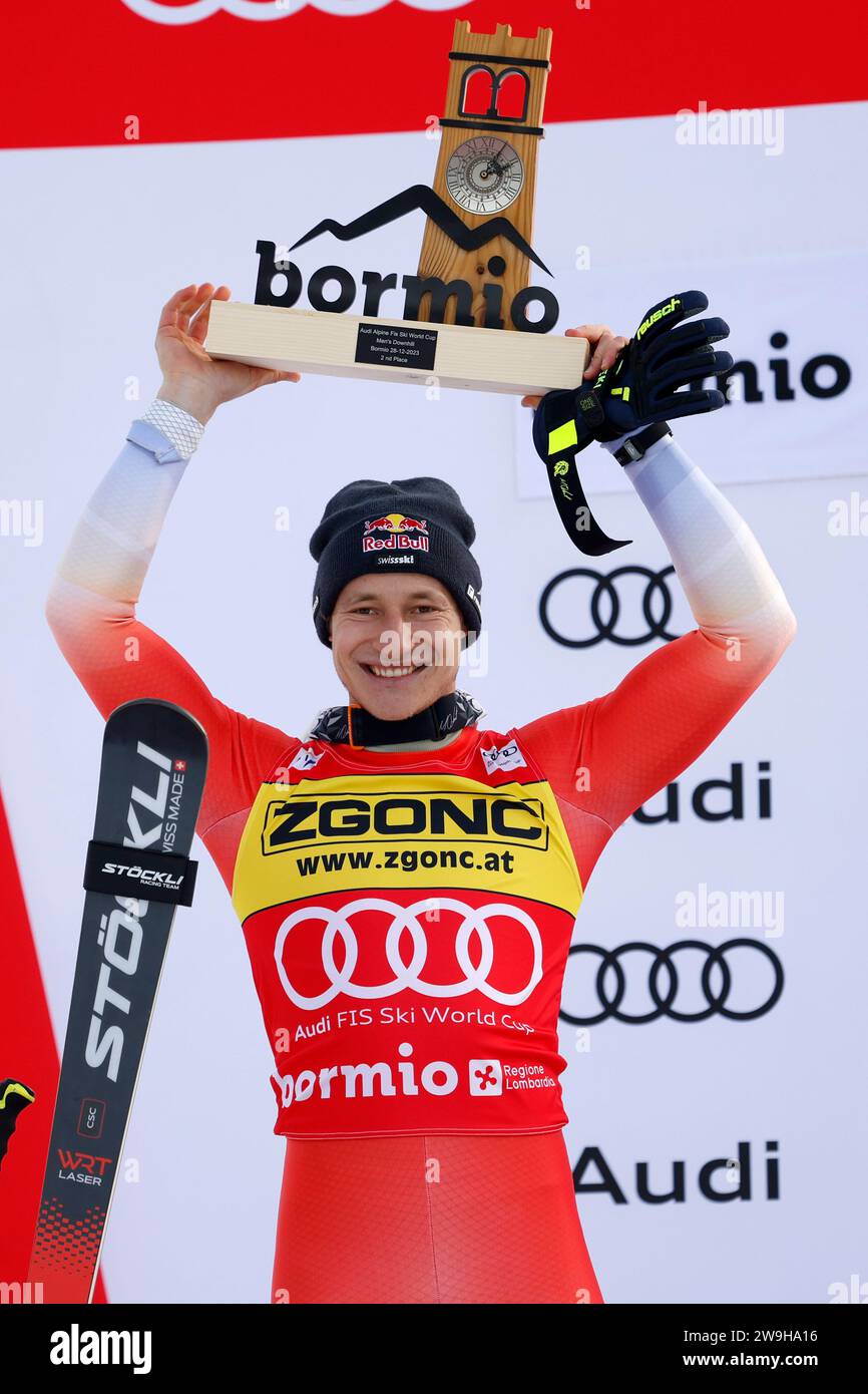 Switzerland's Marco Odermatt celebrates on the podium after taking ...
