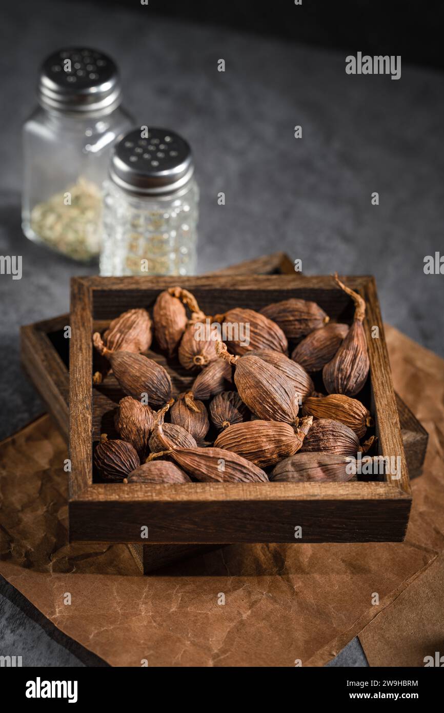 Spices in wooden box:Tsaoko Amomum Fruit Stock Photo - Alamy