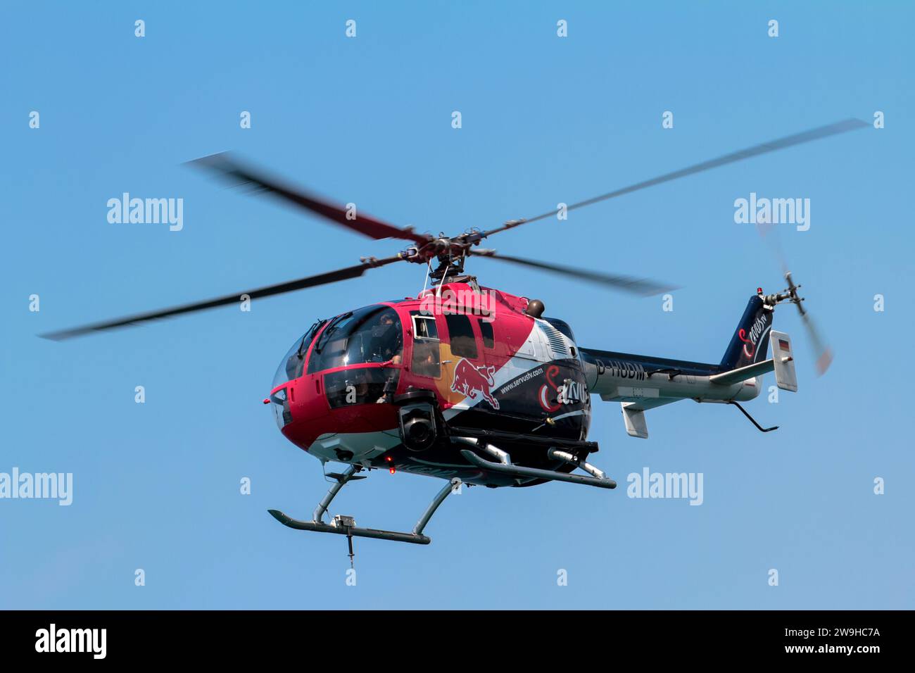 Modern helicopter in flight, creating mesmerizing rotor motion blur ...