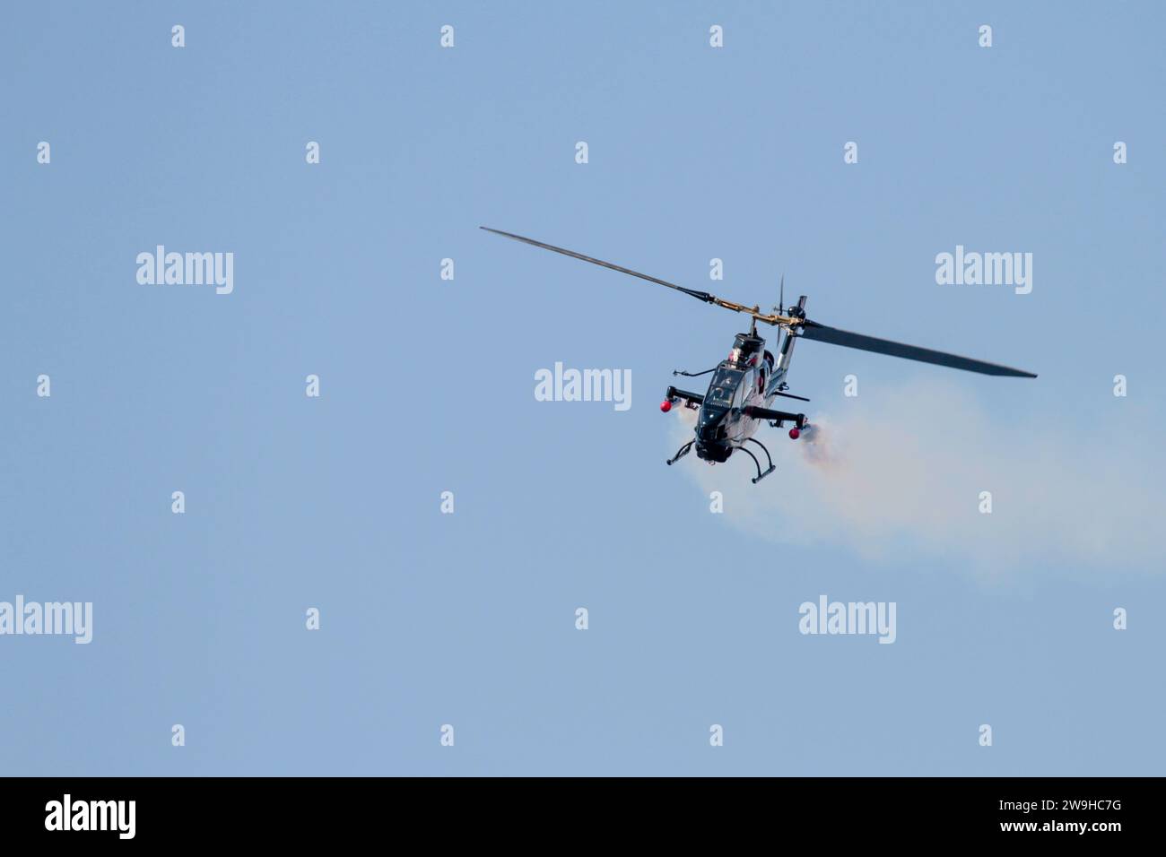Modern helicopter in flight, creating mesmerizing rotor motion blur ...