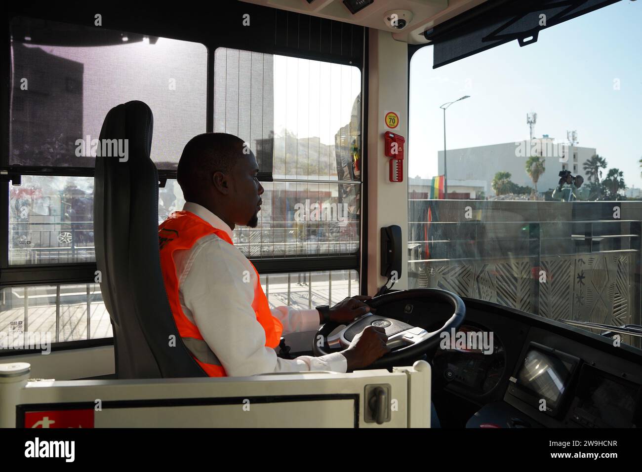 Dakar, Senegal. 27th Dec, 2023. A driver prepares to set off a bus for ...
