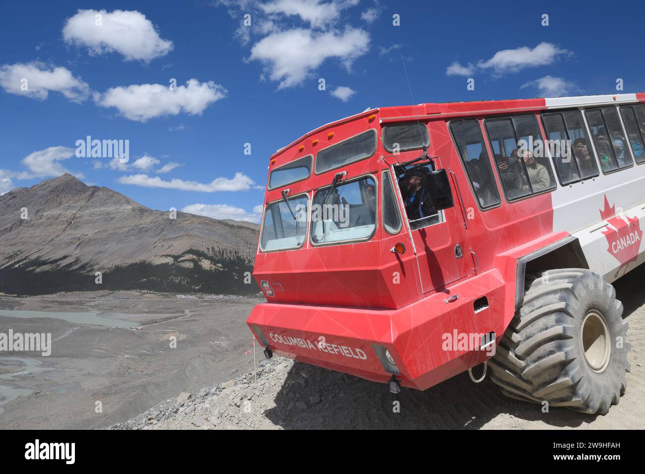 Columbia Icefields snowmobile navigates a steep incline down to the ...