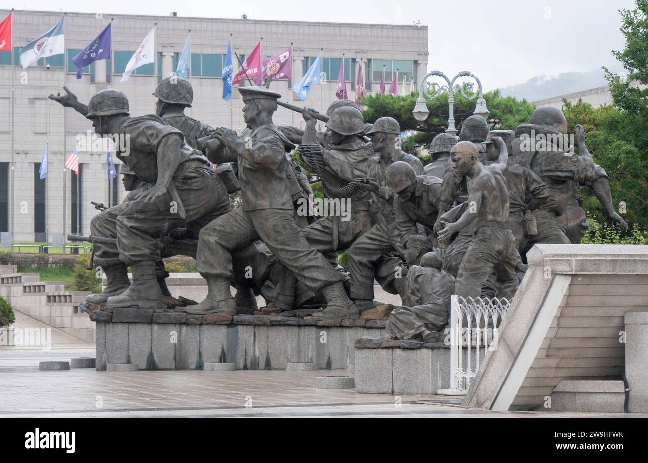 Statues sit in front of the War Memorial of Korea in Seoul. It was ...