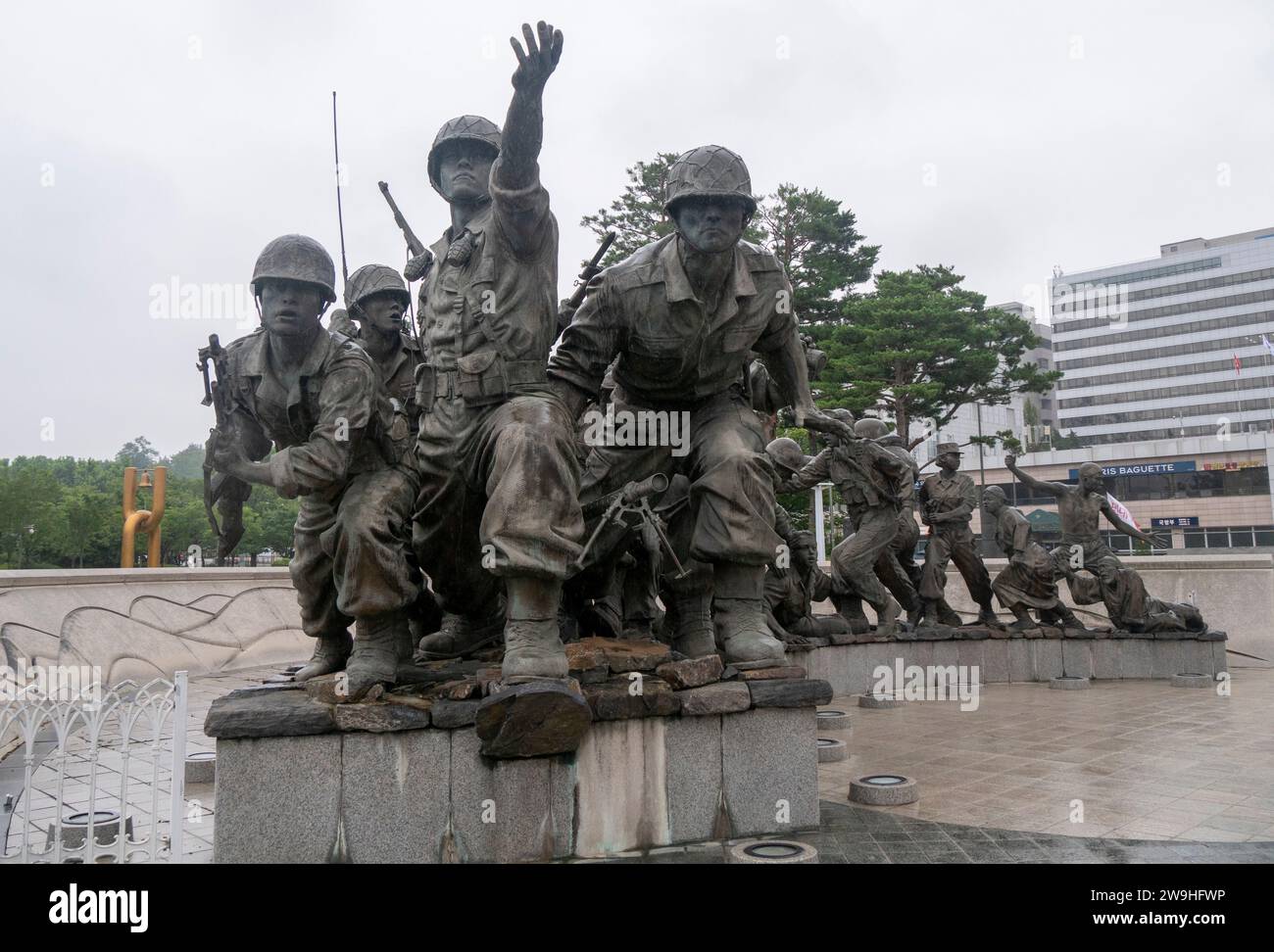Statues sit in front of the War Memorial of Korea in Seoul. It was ...
