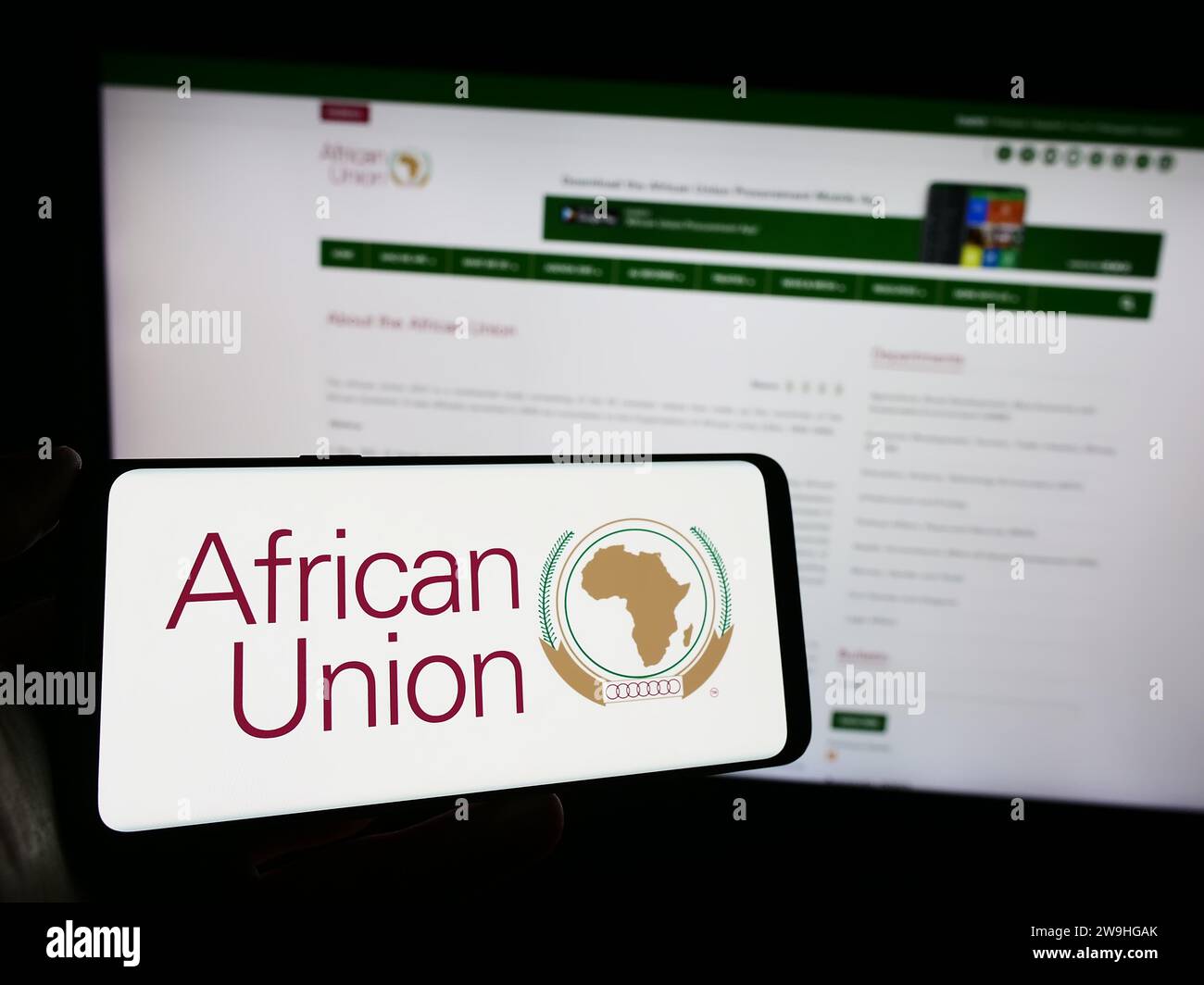 Person holding mobile phone with logo of continental organization ...